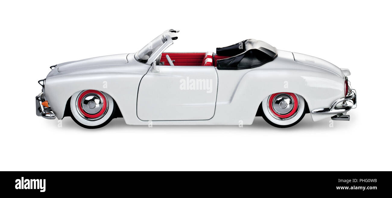 White vintage cabriolet model on a white background Stock Photo - Alamy