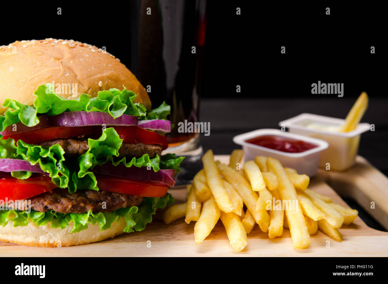 Burger served in bun in nutrition fast food concept Stock Photo - Alamy