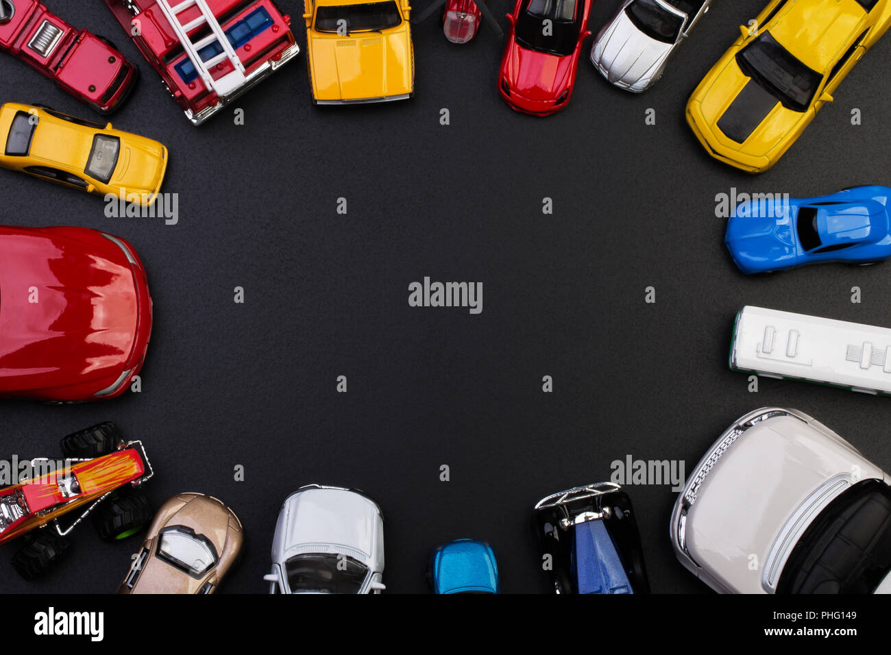 Toys model cars view from above on a black background Stock Photo - Alamy