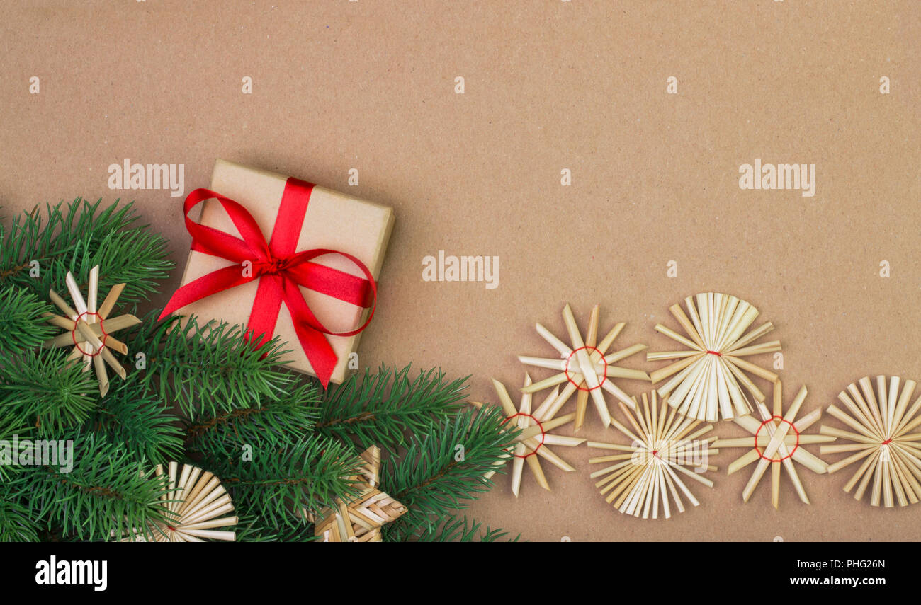 Cardboard box, handmade gift, christmas tree branch and woody vintage ...