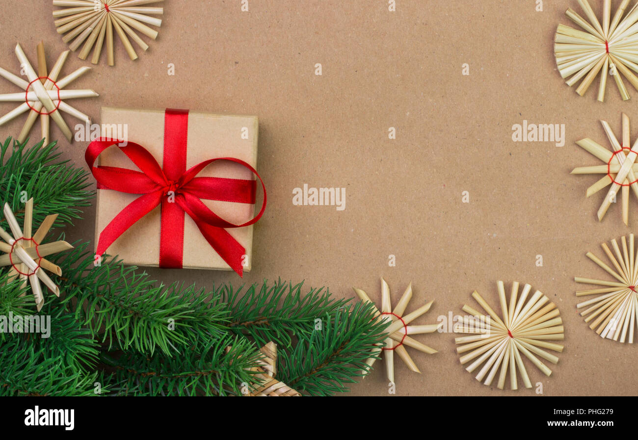 Cardboard box, handmade gift, christmas tree branch and woody vintage ...