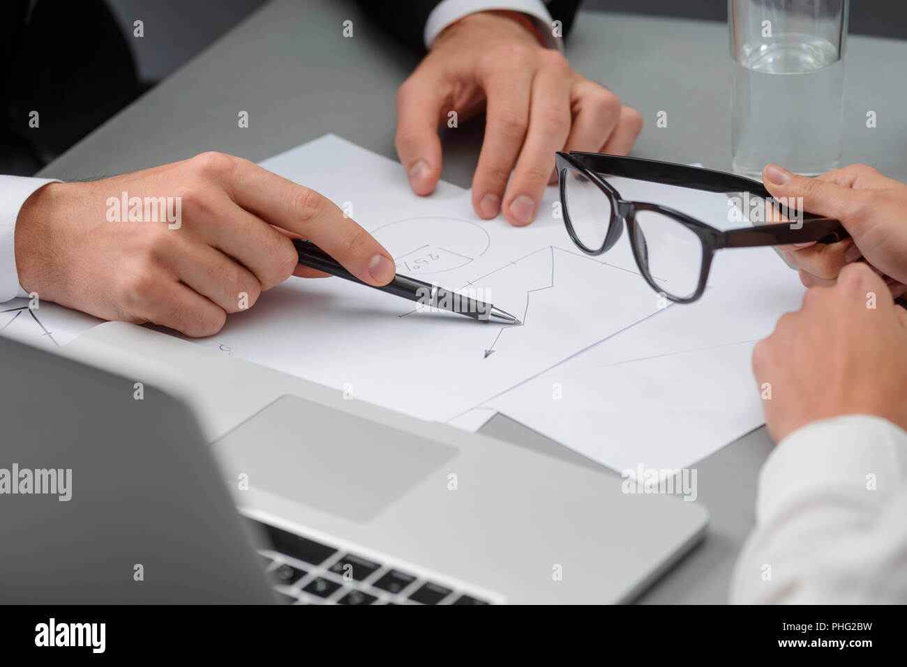 Business team's having a debriefing Stock Photo - Alamy