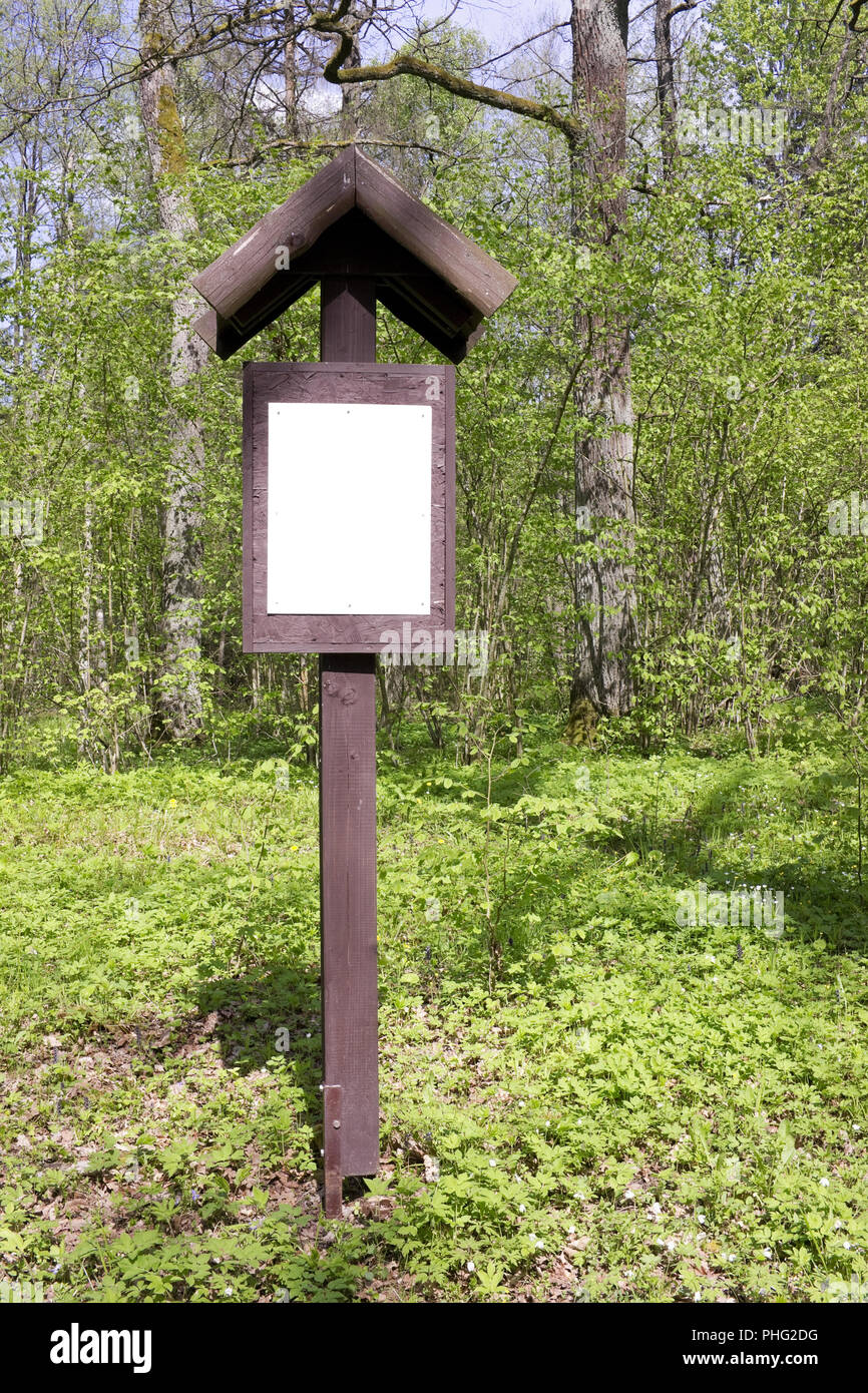 Forest wooden red sign Stock Photo - Alamy