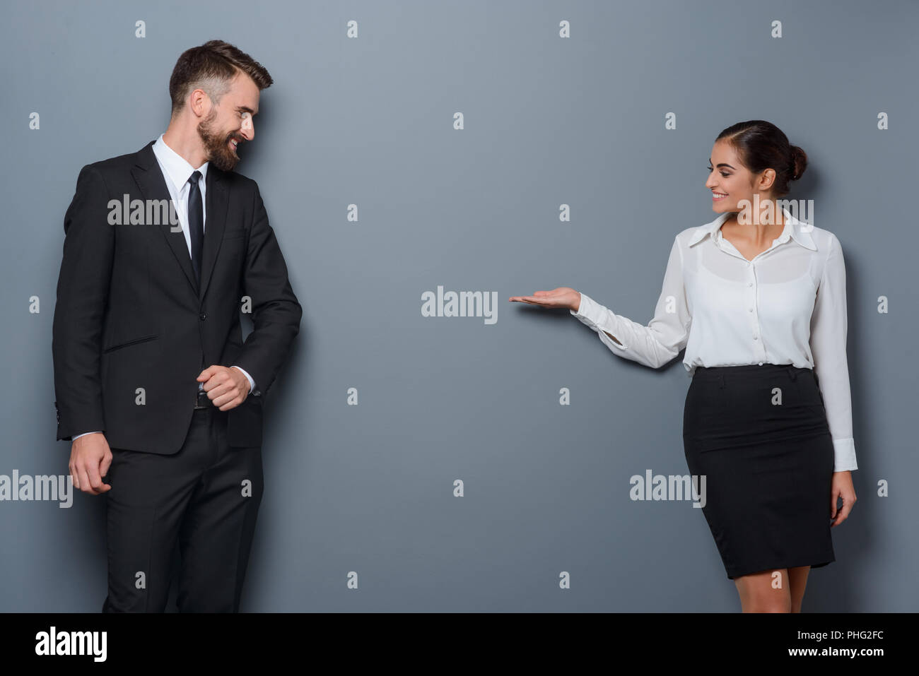 Woman shows something abstract Stock Photo - Alamy