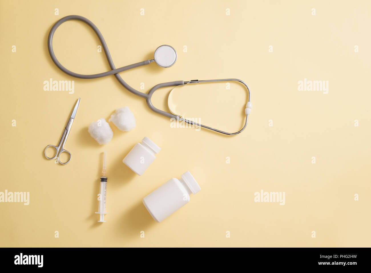 Health care concept. Composition with pills and medical stuff on yellow ...