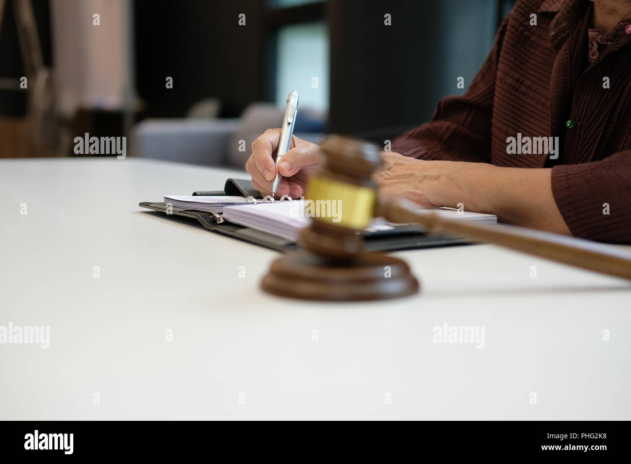judge oranizing plan, writing note with legal law gavel at courtroom ...