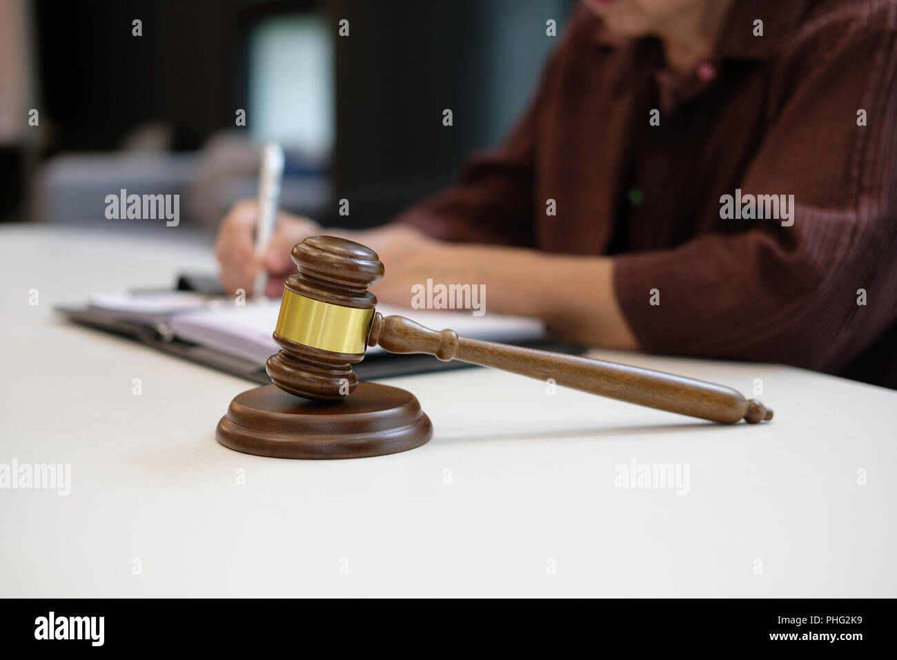 judge oranizing plan, writing note with legal law gavel at courtroom ...