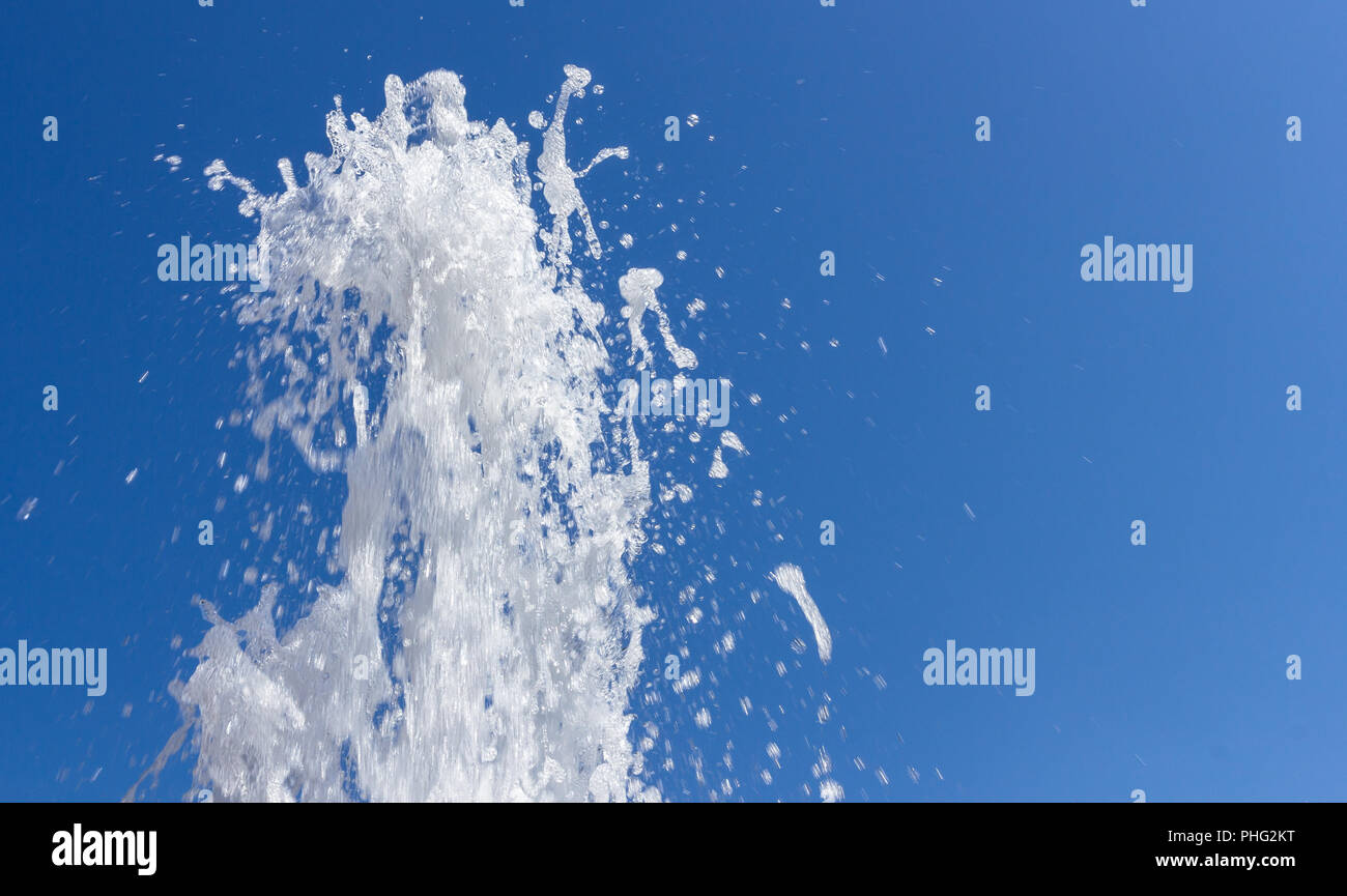 Water jet in blue sky Stock Photo - Alamy