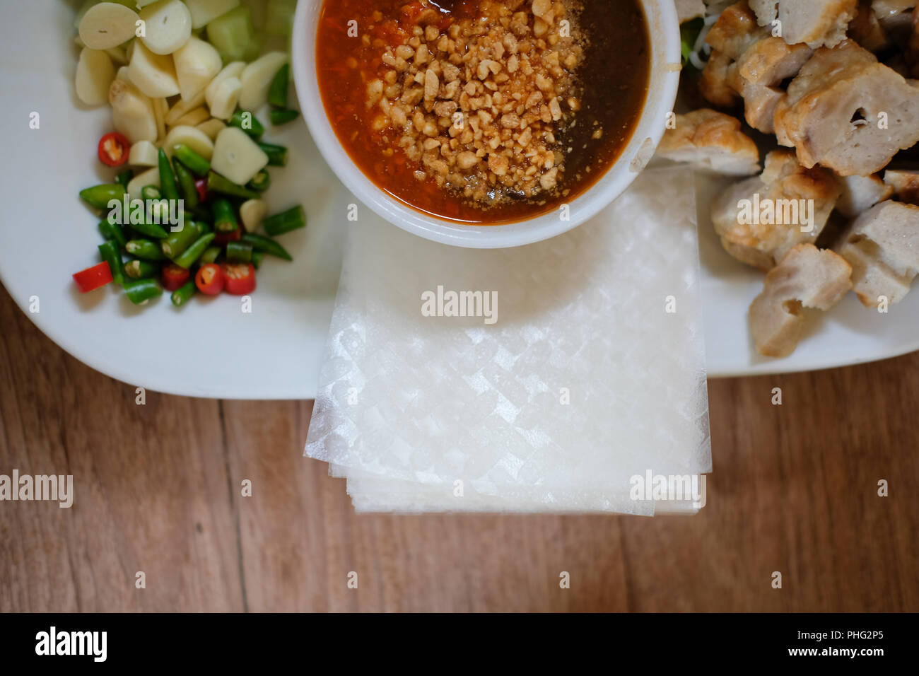 minced pork sausage, fermented rice noodle & vegetable served with ...