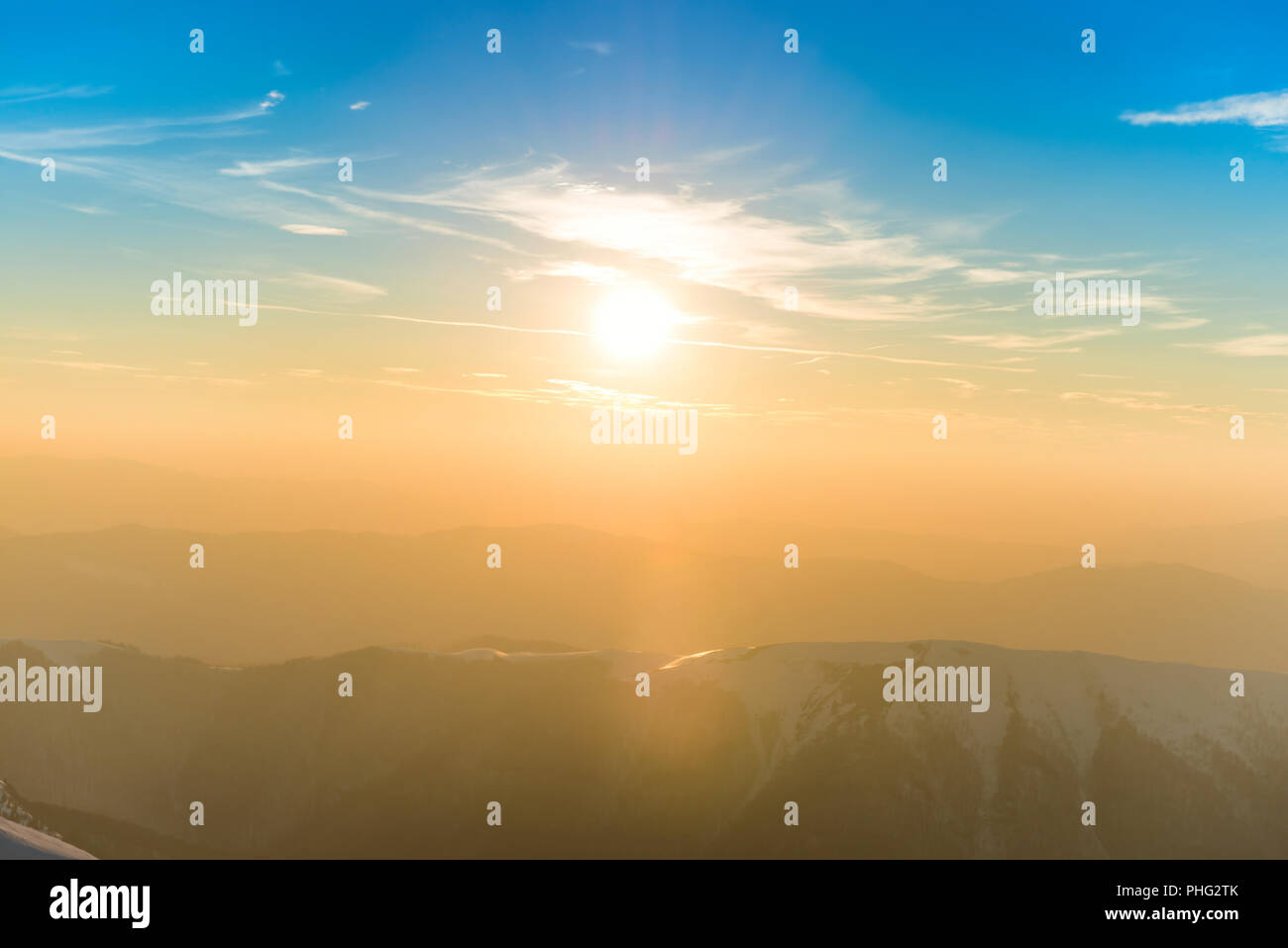 Beautiful sunset over snowy mountains hi-res stock photography and images - Alamy