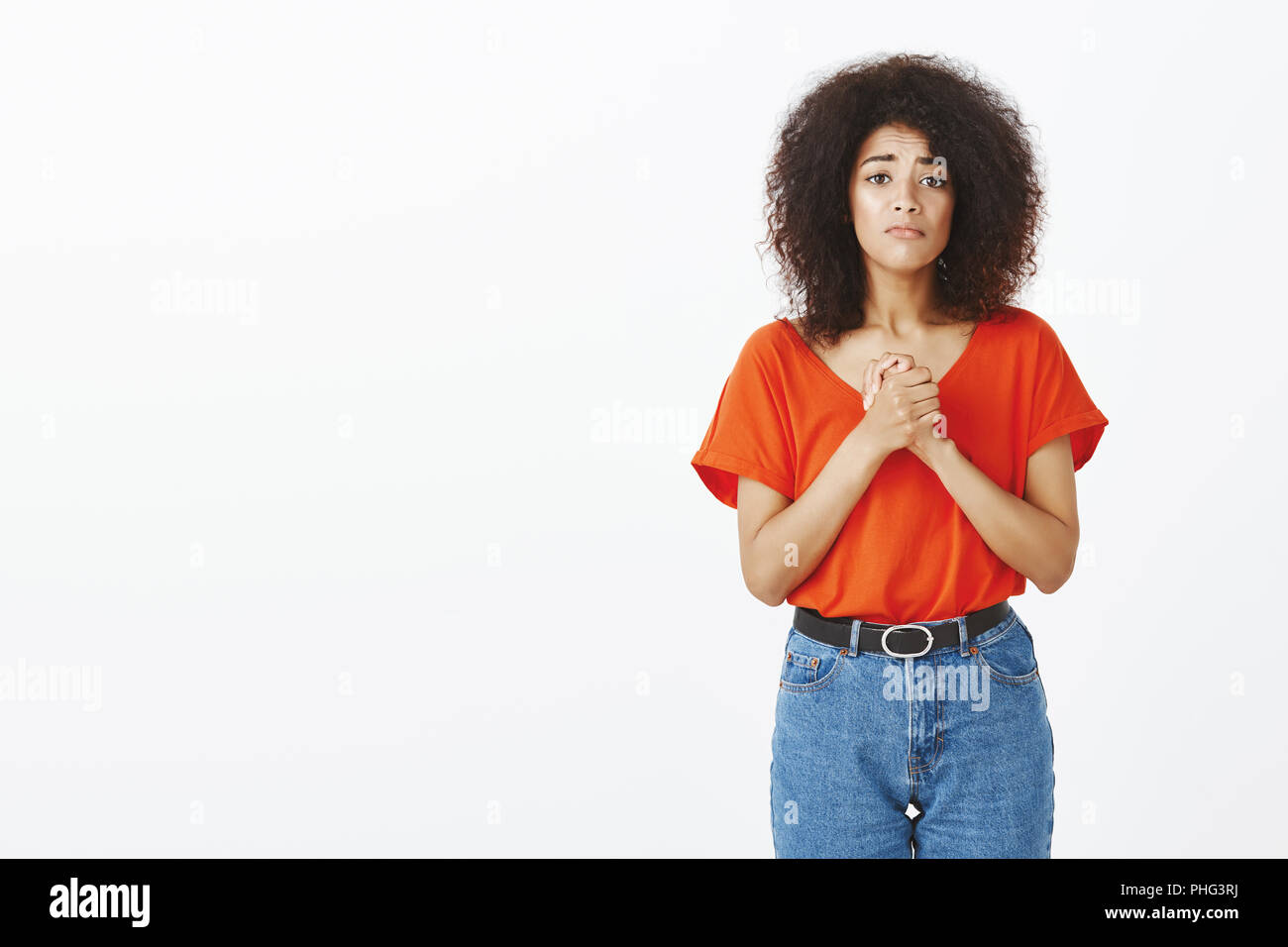 Beg you to help me. Portrait of good-looking curly-haired woman ...