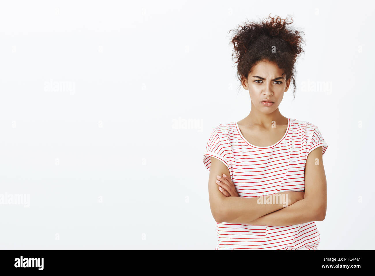 Not talking to you unless hear apology. Portrait of sulking cute dark ...