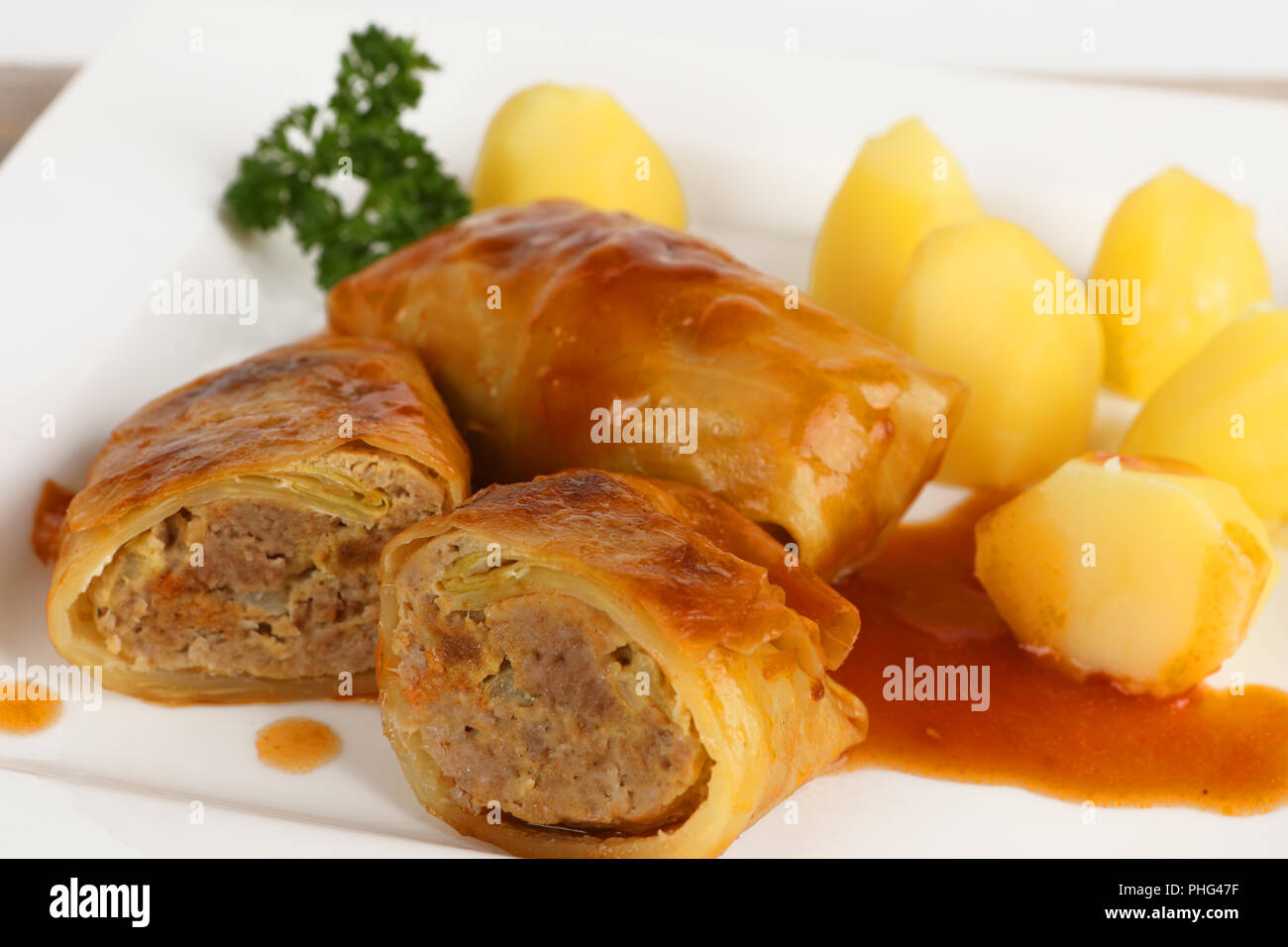 cabbage roulade with potatoes Stock Photo - Alamy