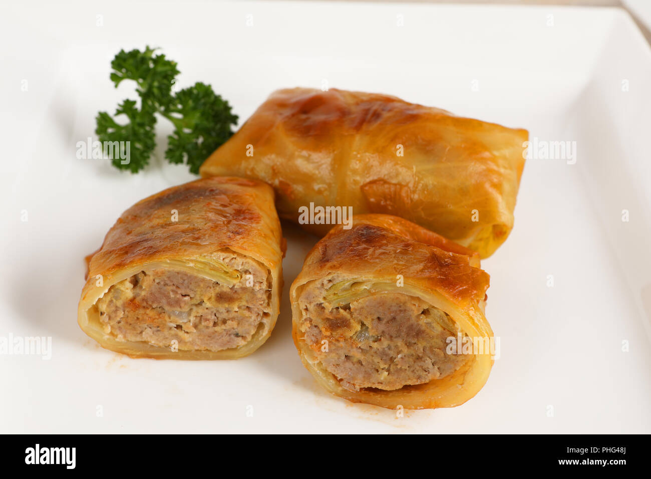 cabbage roulade filled with minced meat Stock Photo - Alamy
