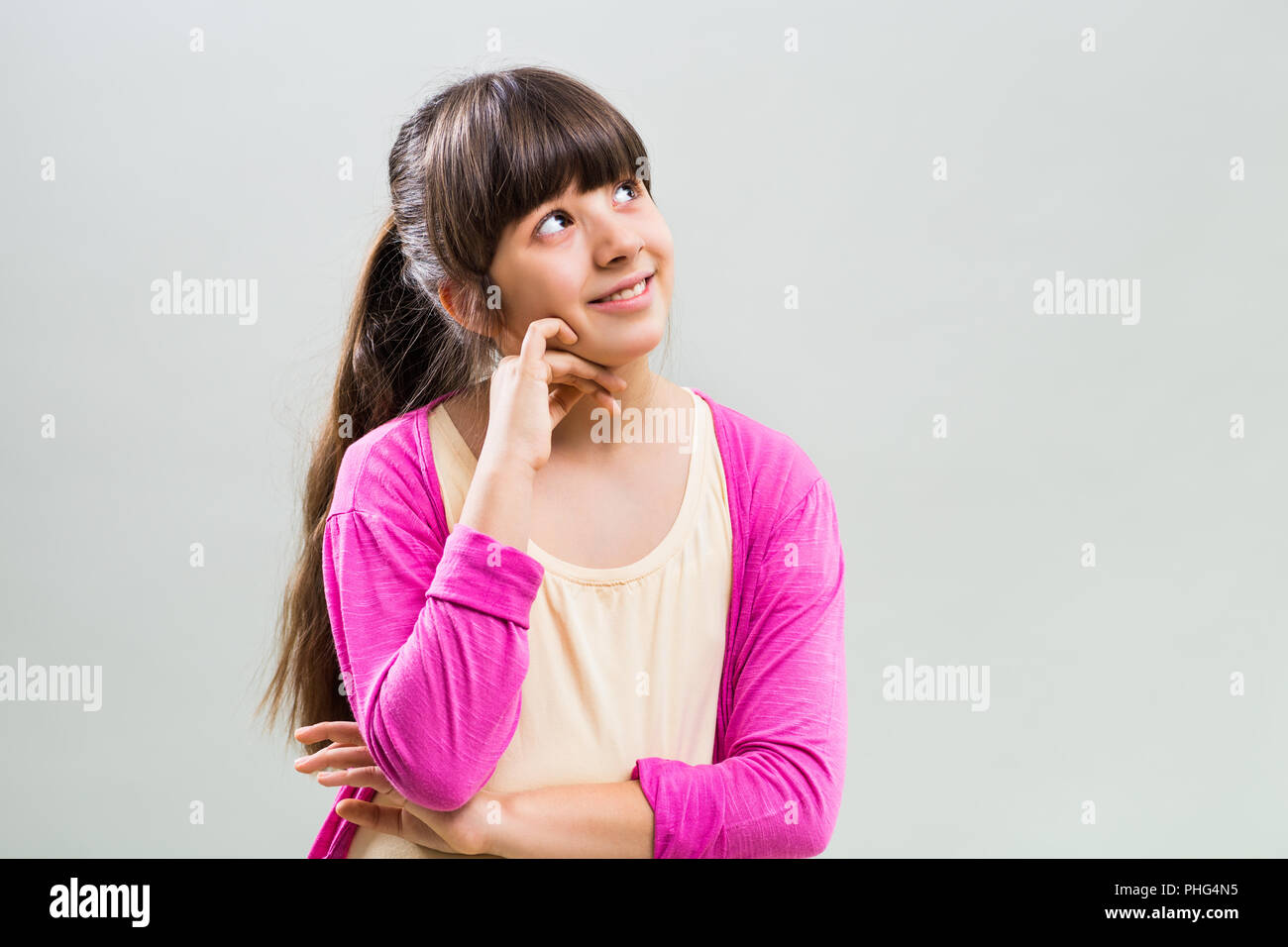 Little girl thinking about something Stock Photo - Alamy