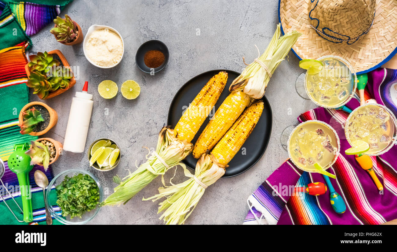 Cooking crilling mexican street corn elote Stock Photo - Alamy