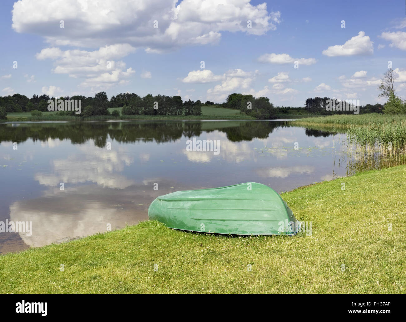 Green boat on lake Stock Photo - Alamy