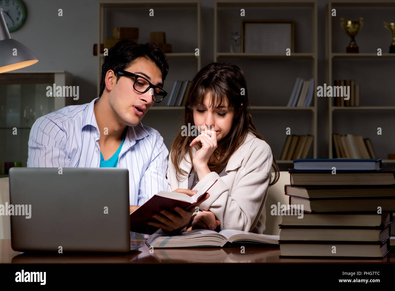 Two students studying late preparing for exams Stock Photo - Alamy