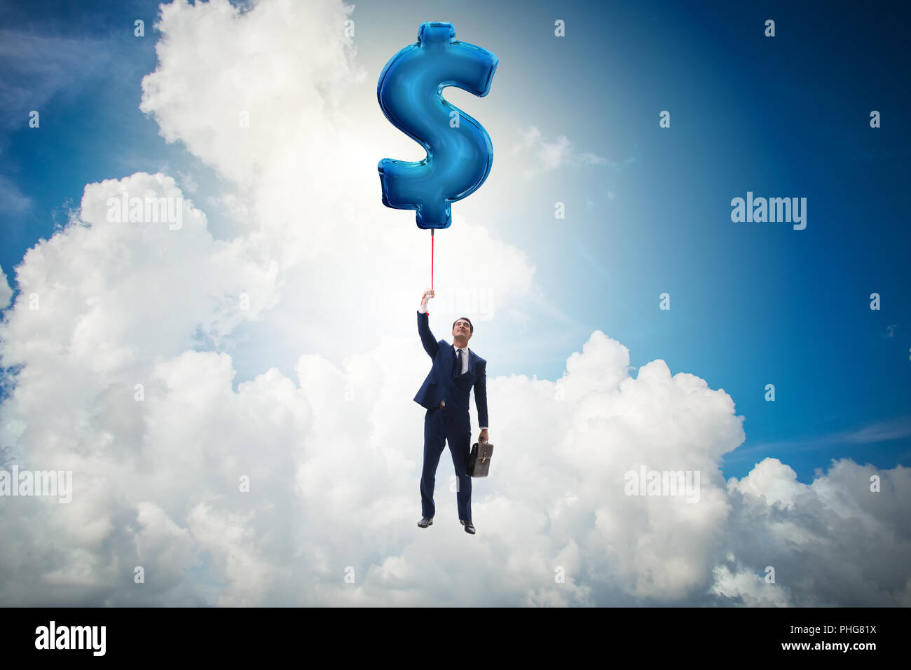 Businessman flying on dollar sign inflatable balloon Stock Photo - Alamy