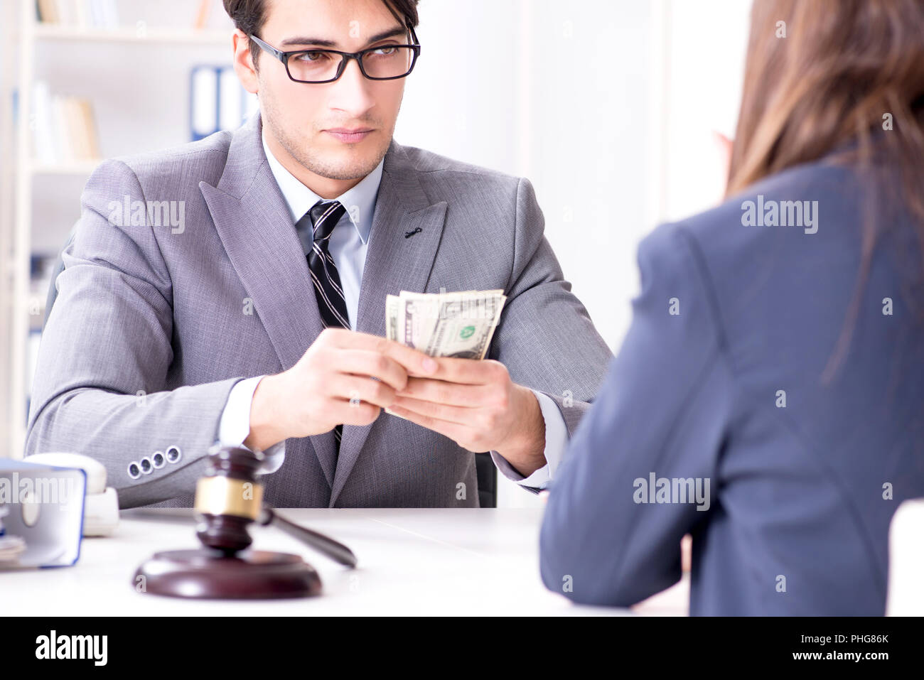 Lawyer being offered bribe for his services Stock Photo - Alamy