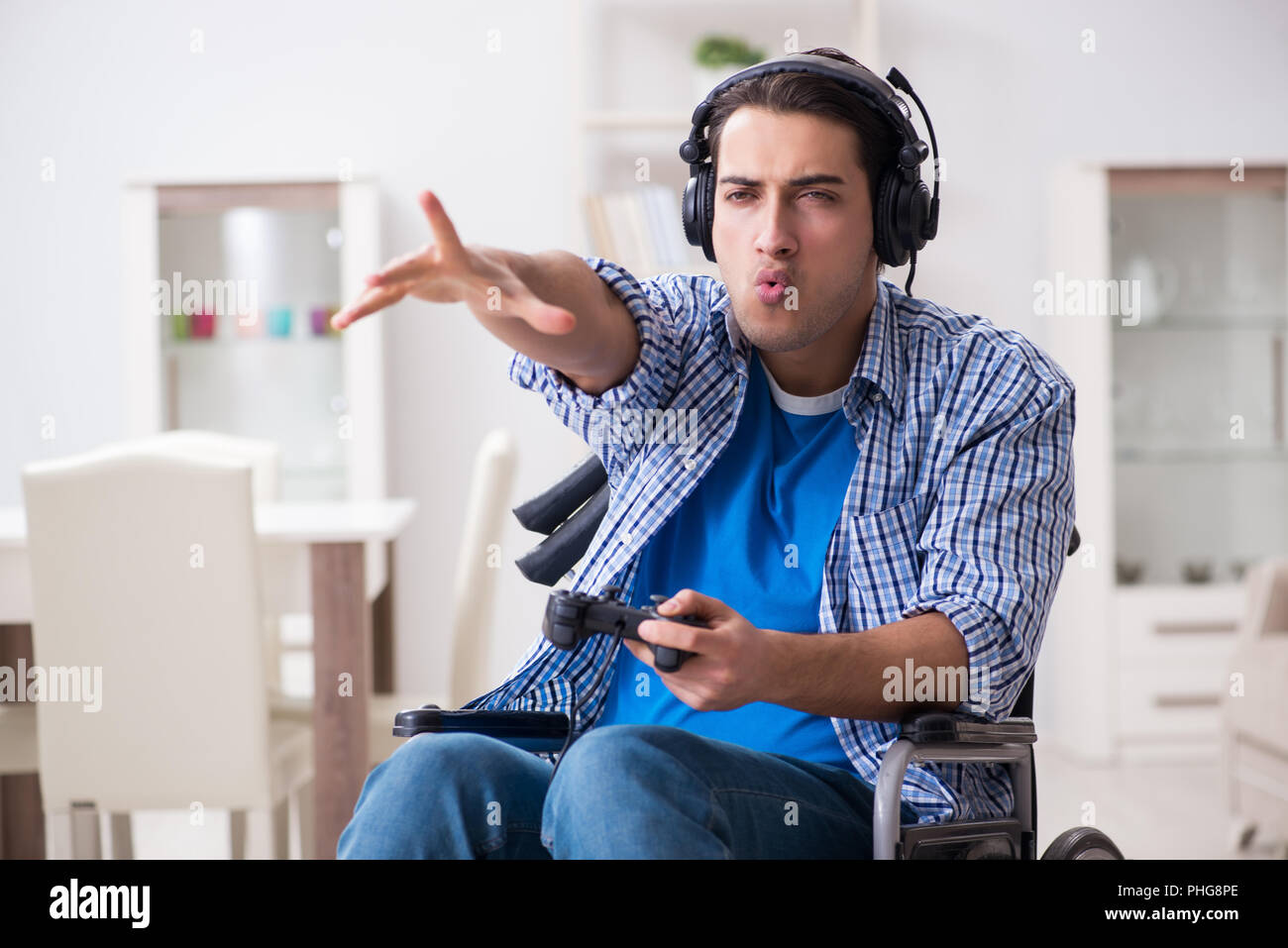 Disabled man playing computer games during rehabilitation Stock Photo ...