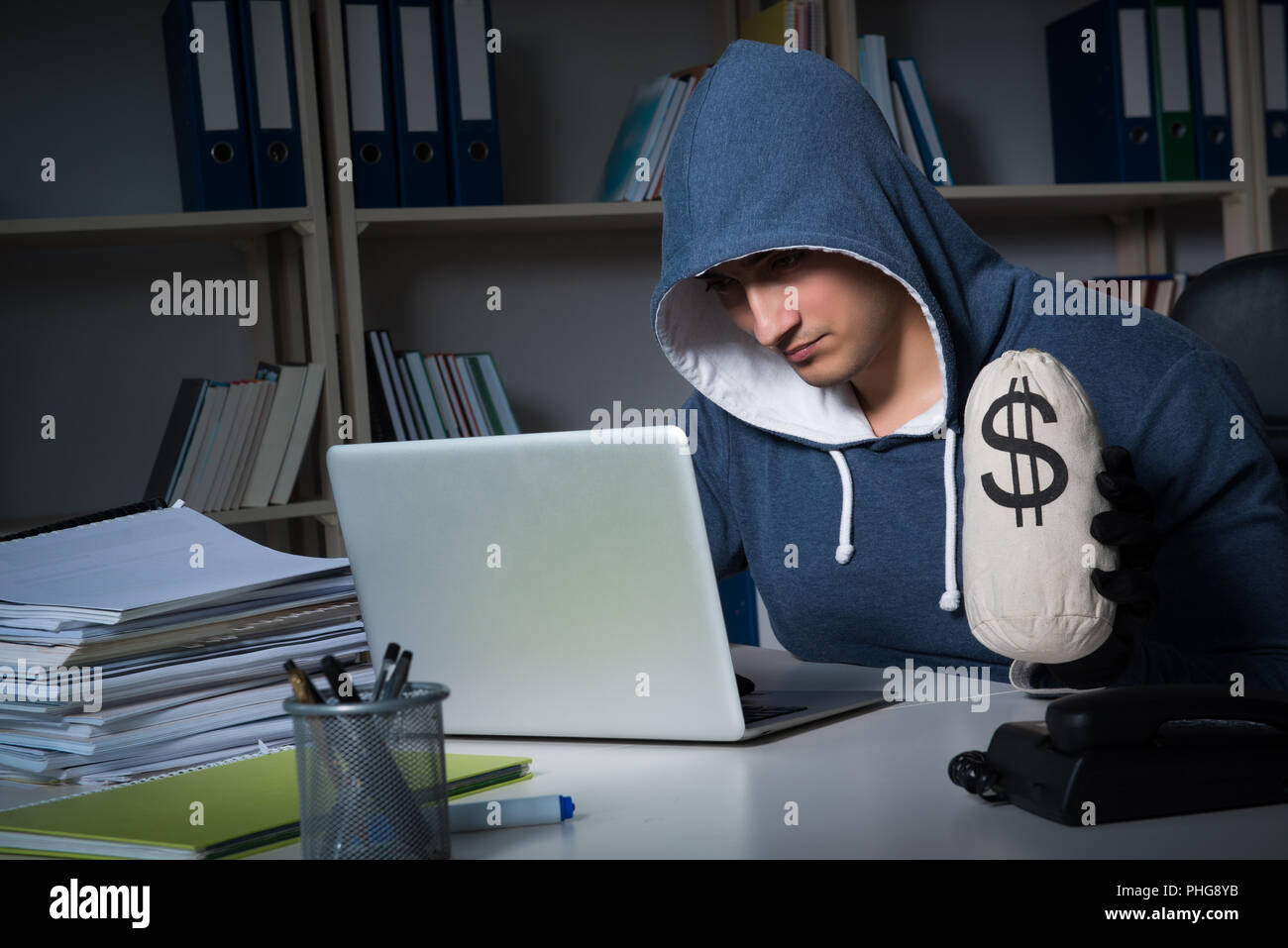 Young hacker hacking into computer at night Stock Photo - Alamy
