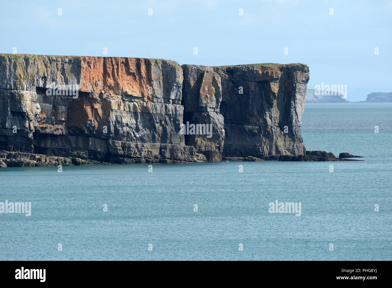 Stackpole Head, seen from the sea showing the steep sea cliffs of ...