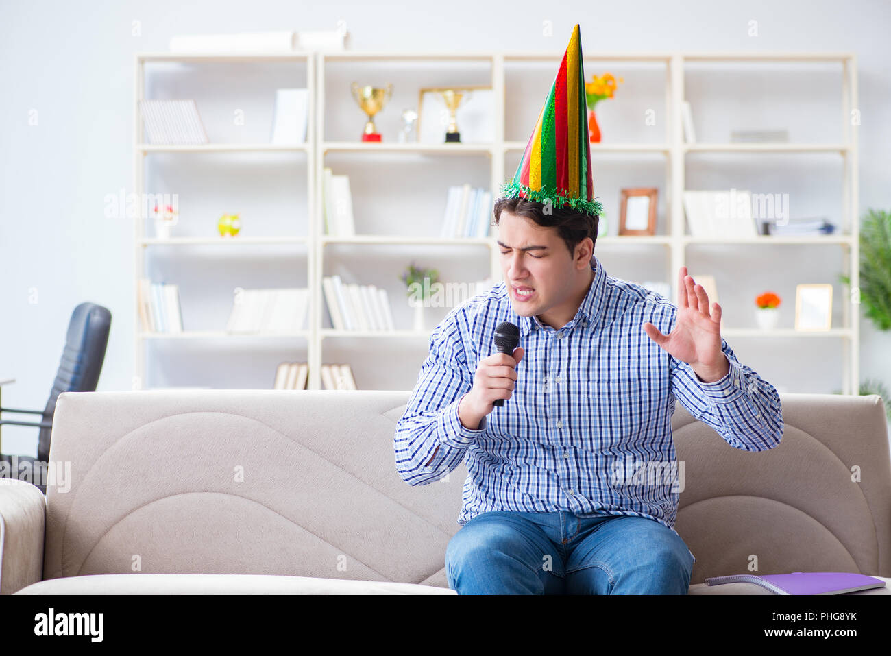 Funny man singing songs in karaoke at home Stock Photo - Alamy