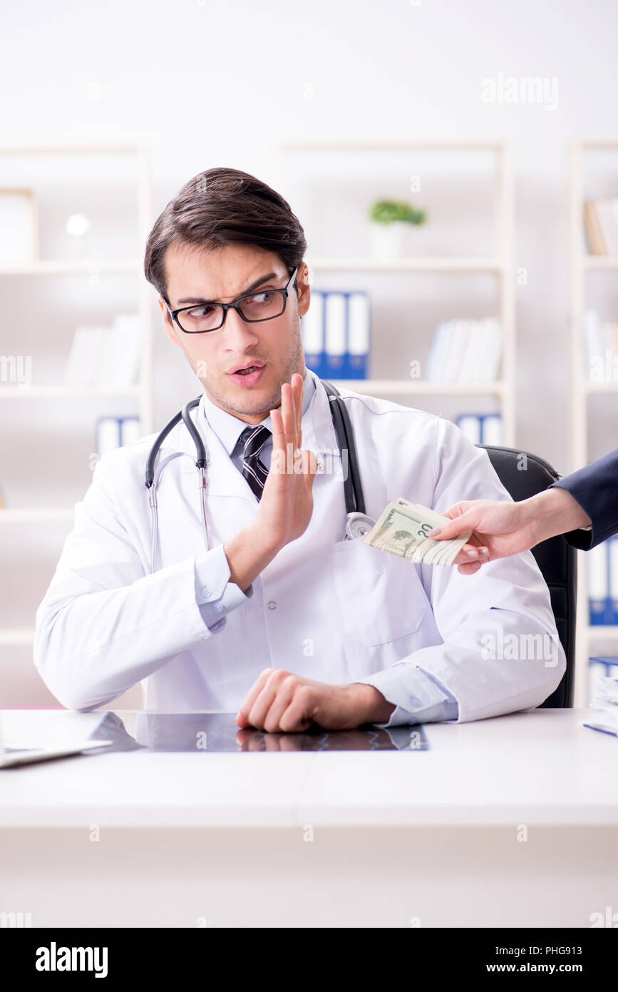 Doctor refusing cash payment hi-res stock photography and images - Alamy