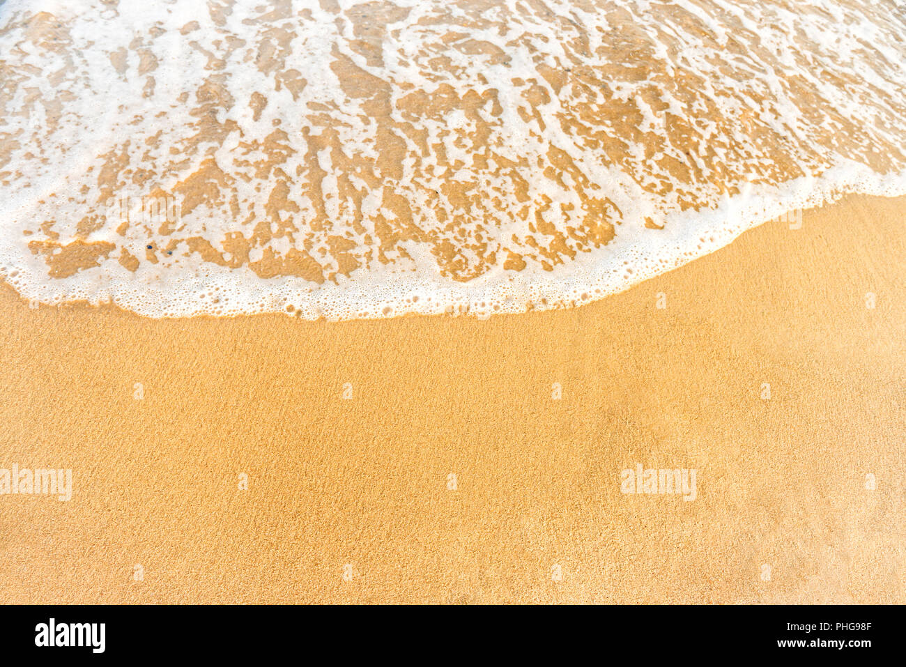 Beach sand and ocean wave Stock Photo - Alamy