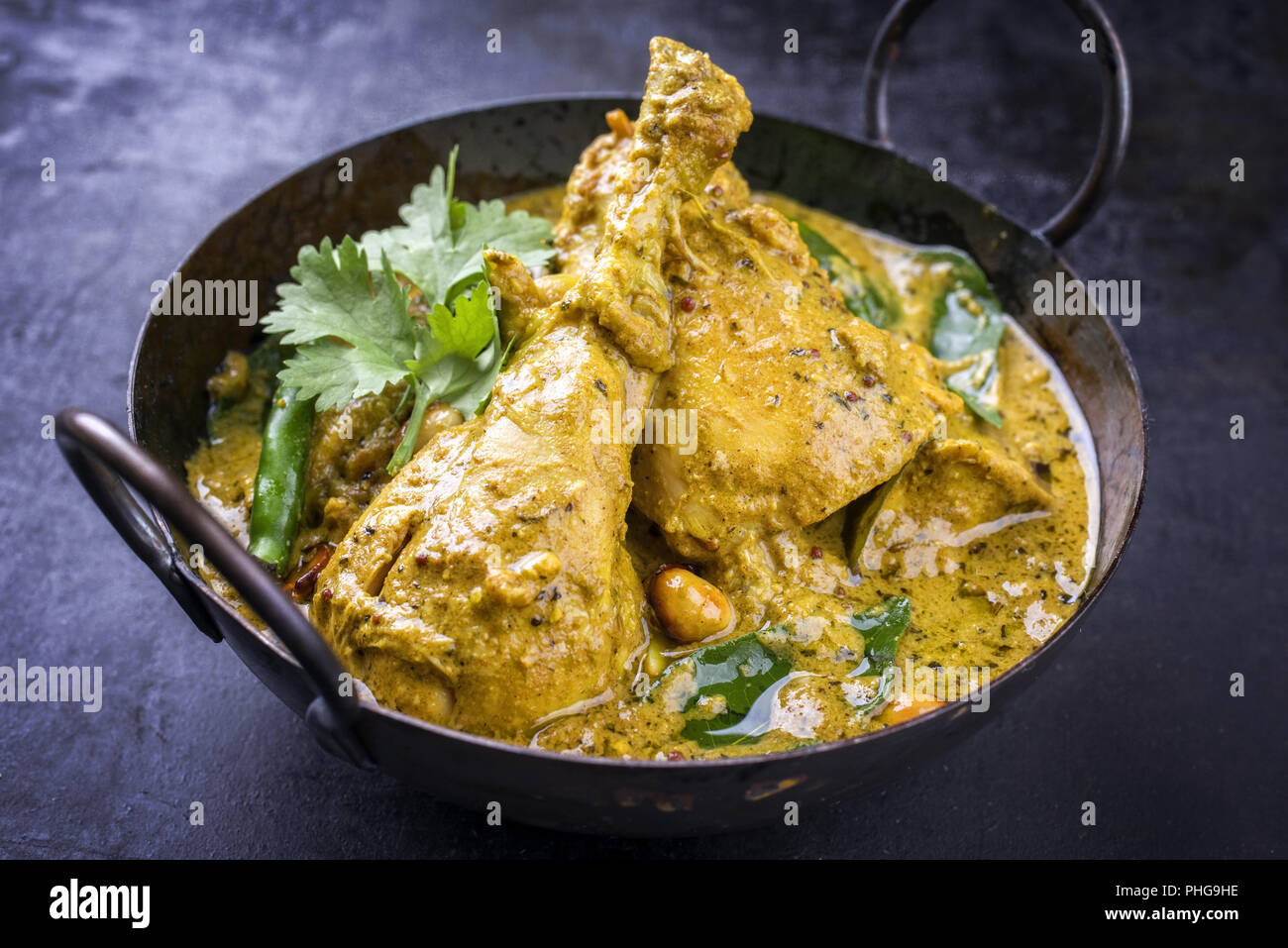 Traditional Indian curry chicken as close-up in a Korai Stock Photo - Alamy