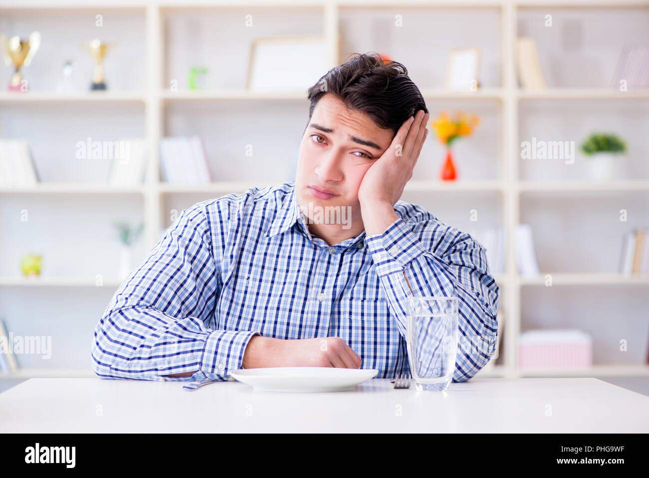 Man on diet waiting for food in restaurant Stock Photo - Alamy