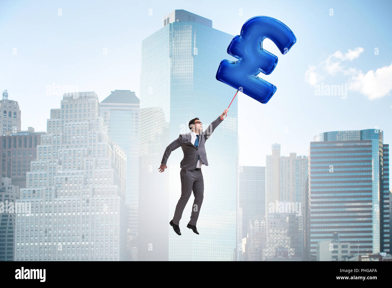 Businessman flying on british pound sign inflatable balloon Stock Photo ...