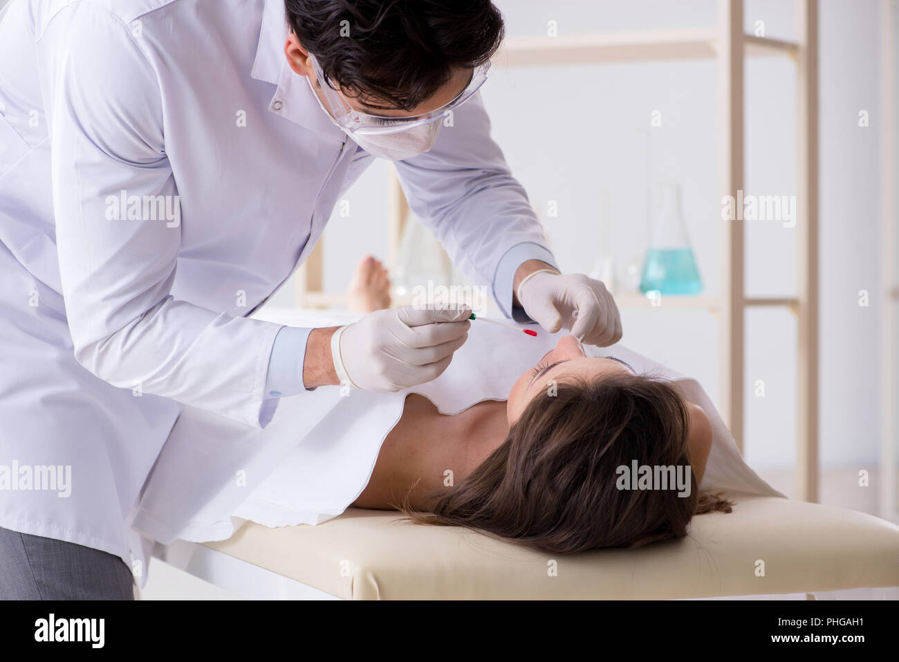 Police coroner examining dead body corpse in morgue Stock Photo - Alamy