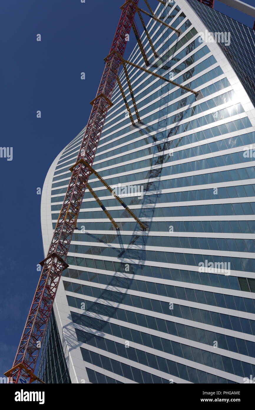 Curved building with construction support Stock Photo - Alamy