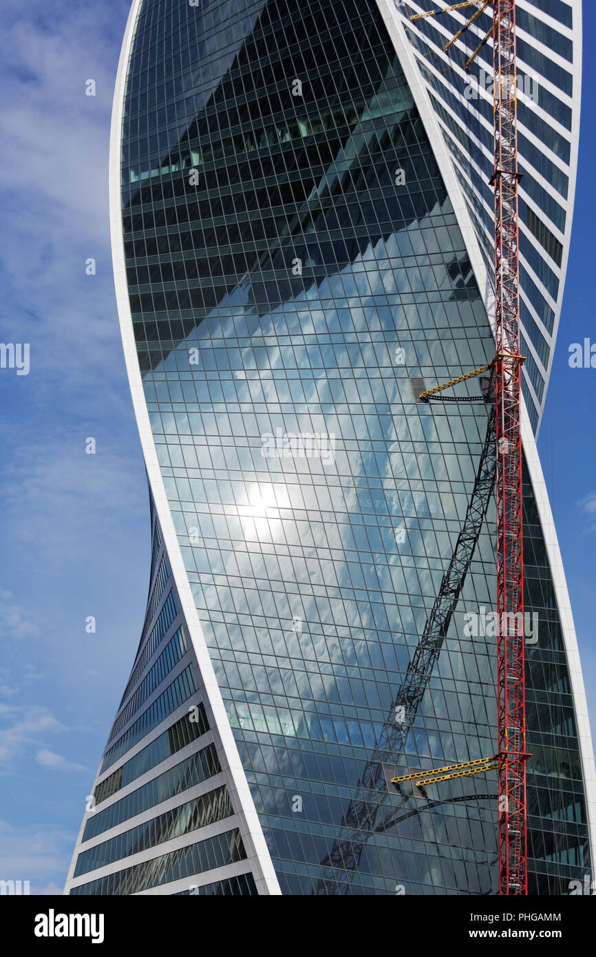 Curved building with construction support Stock Photo - Alamy