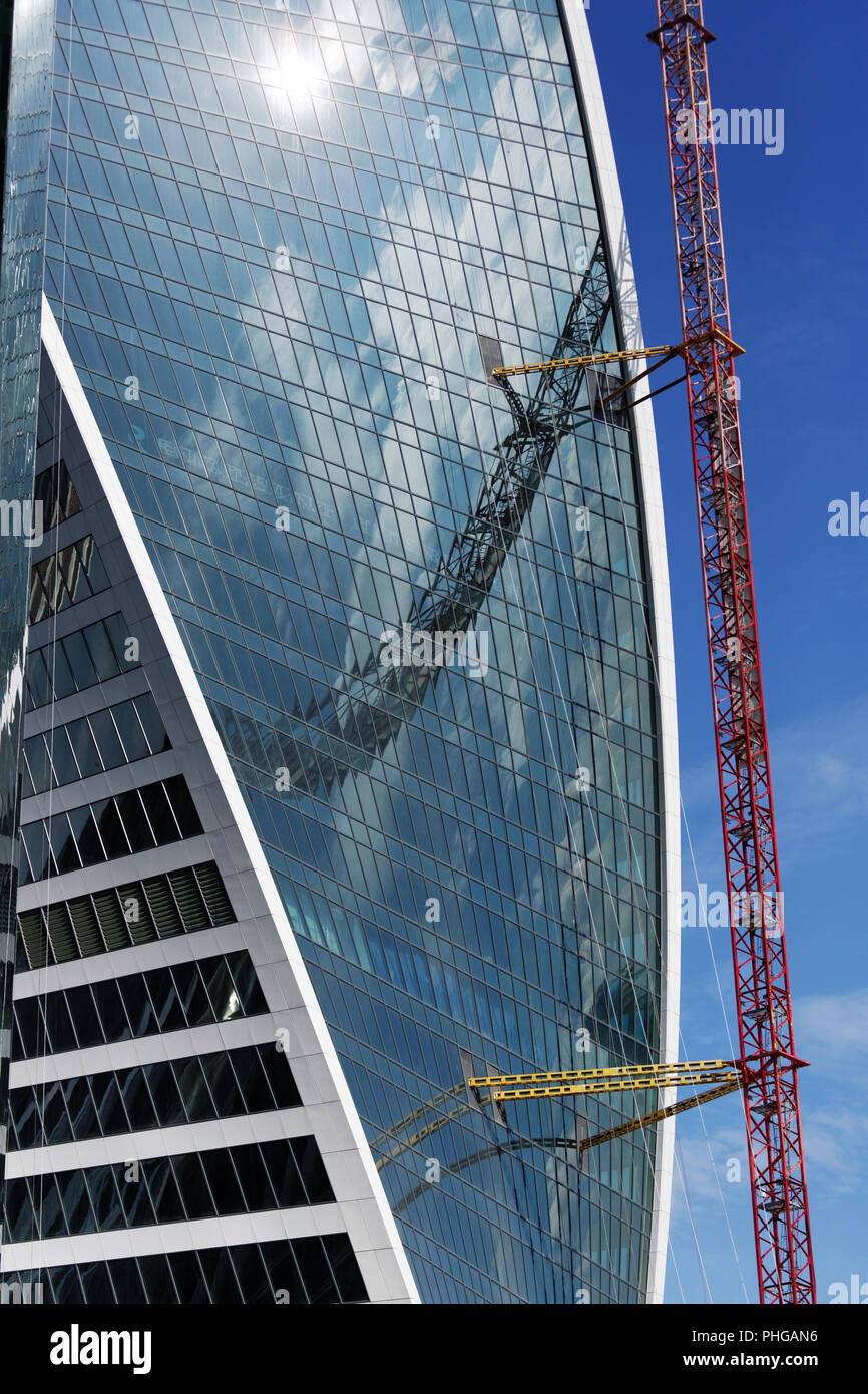 Curved building with construction support Stock Photo - Alamy