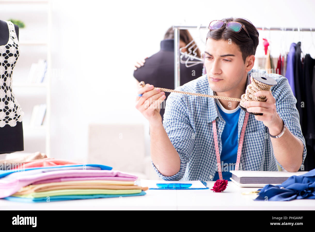 Tailor student cutting fabric hi-res stock photography and images - Alamy