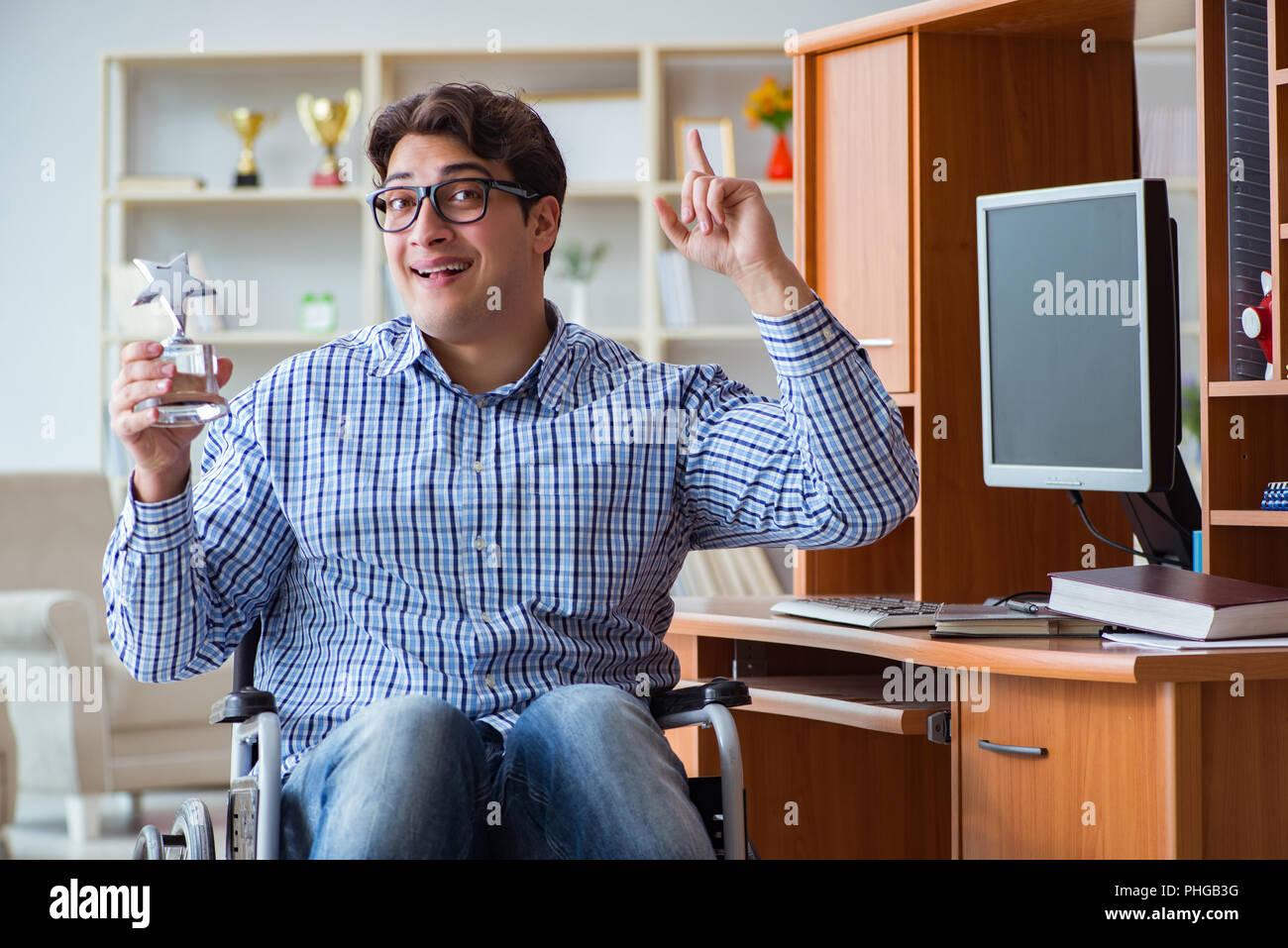 Disabled student studying at home on wheelchair Stock Photo - Alamy