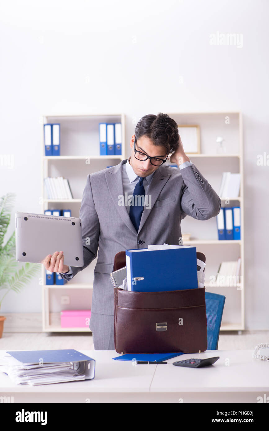 Employee with too much work taking it home Stock Photo - Alamy