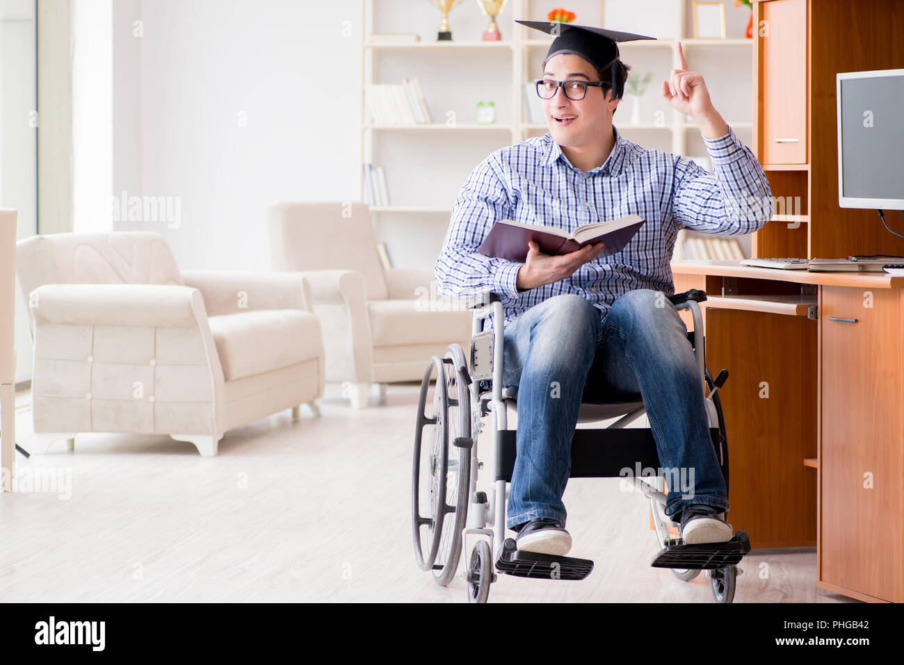 Disabled student studying at home on wheelchair Stock Photo - Alamy