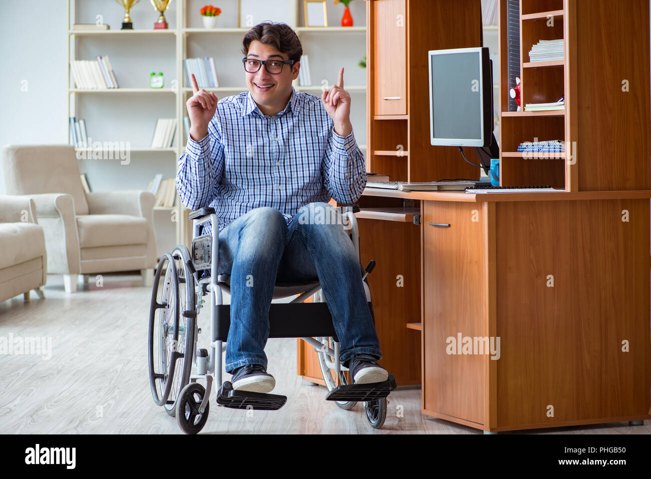 Disabled student studying at home on wheelchair Stock Photo - Alamy