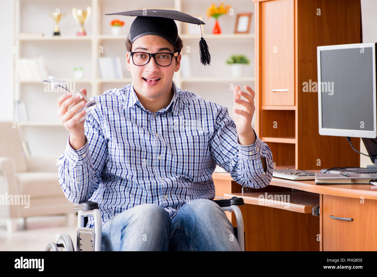 Disabled student studying at home on wheelchair Stock Photo - Alamy