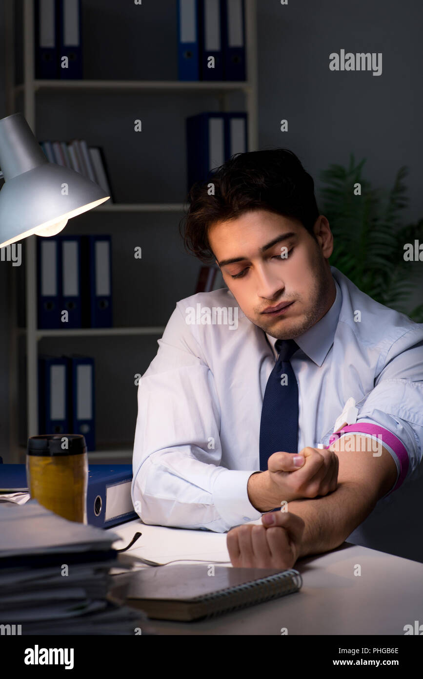 Employee relieving stress from overtime with drugs narcotics Stock ...