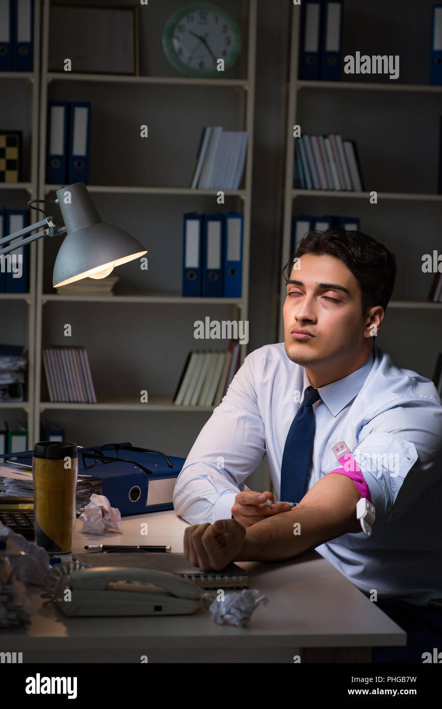 Employee relieving stress from overtime with drugs narcotics Stock ...