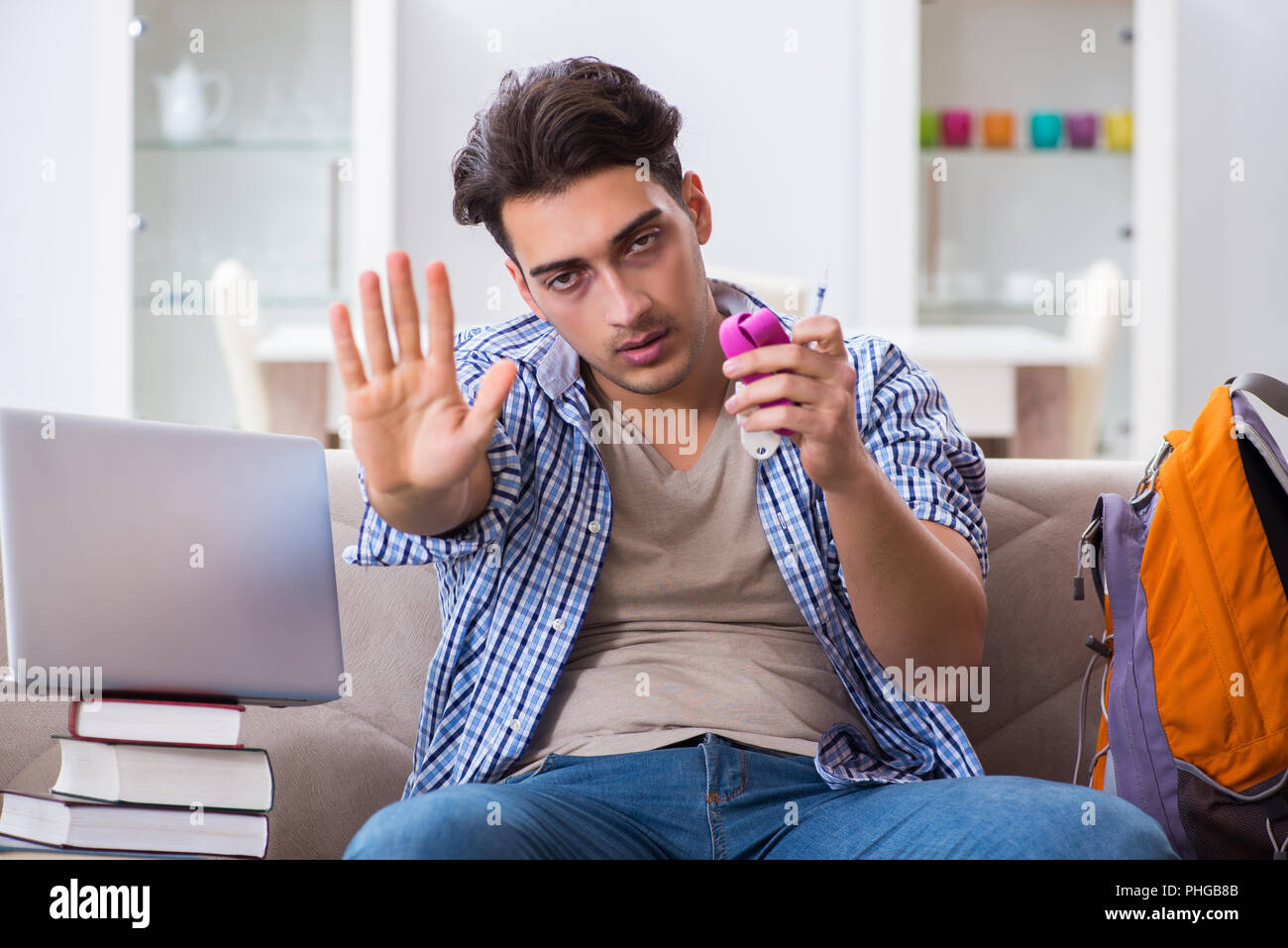 Young student suffeting from drug addiction Stock Photo - Alamy
