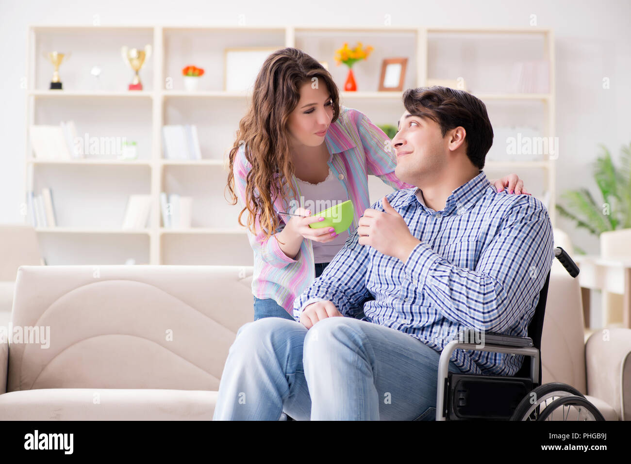 Young family taking care of each other Stock Photo - Alamy