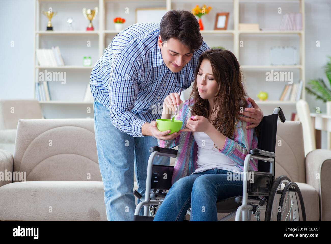 Young family taking care of each other Stock Photo - Alamy