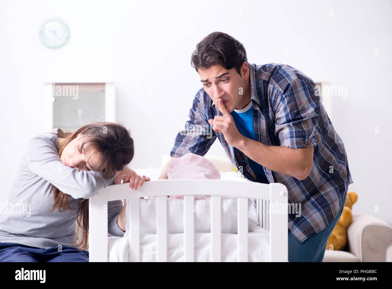 Young dad cannot stand baby crying Stock Photo - Alamy