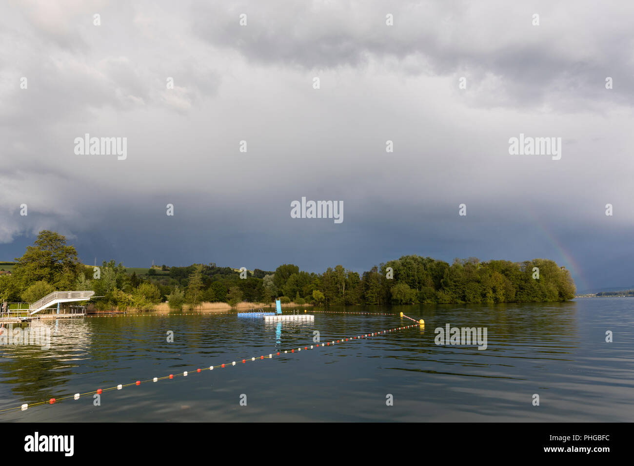 Bathhouse in Lake Sempach at Sursee on a covered spring morning in ...